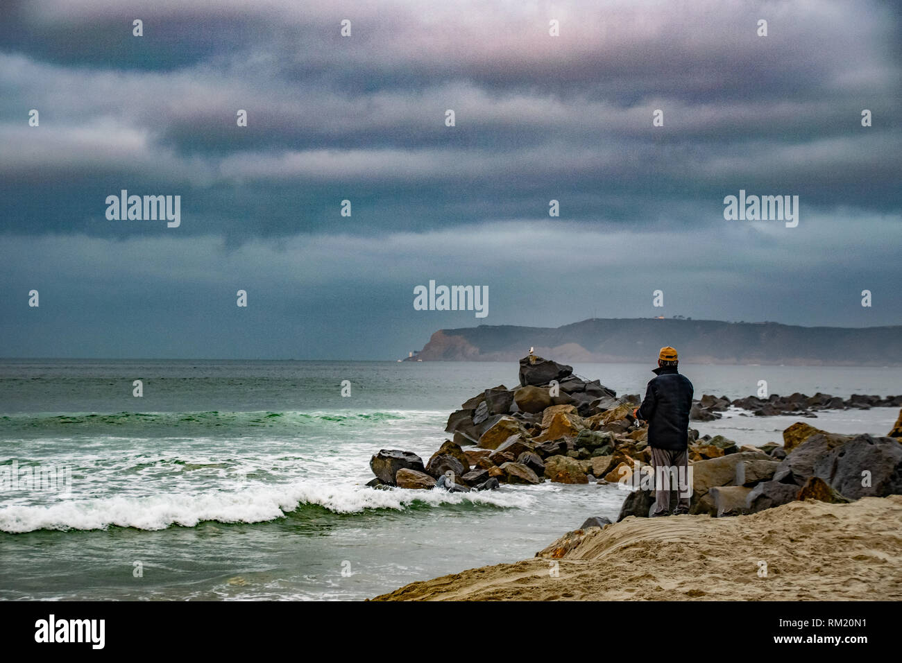 This fisherman cast his line with the Point Loma Peninsula as a ...