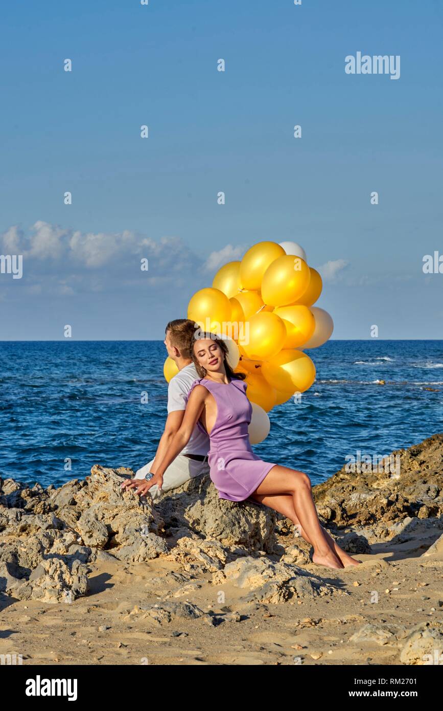 Young Couple Leaning Against Each Other High Resolution Stock ...