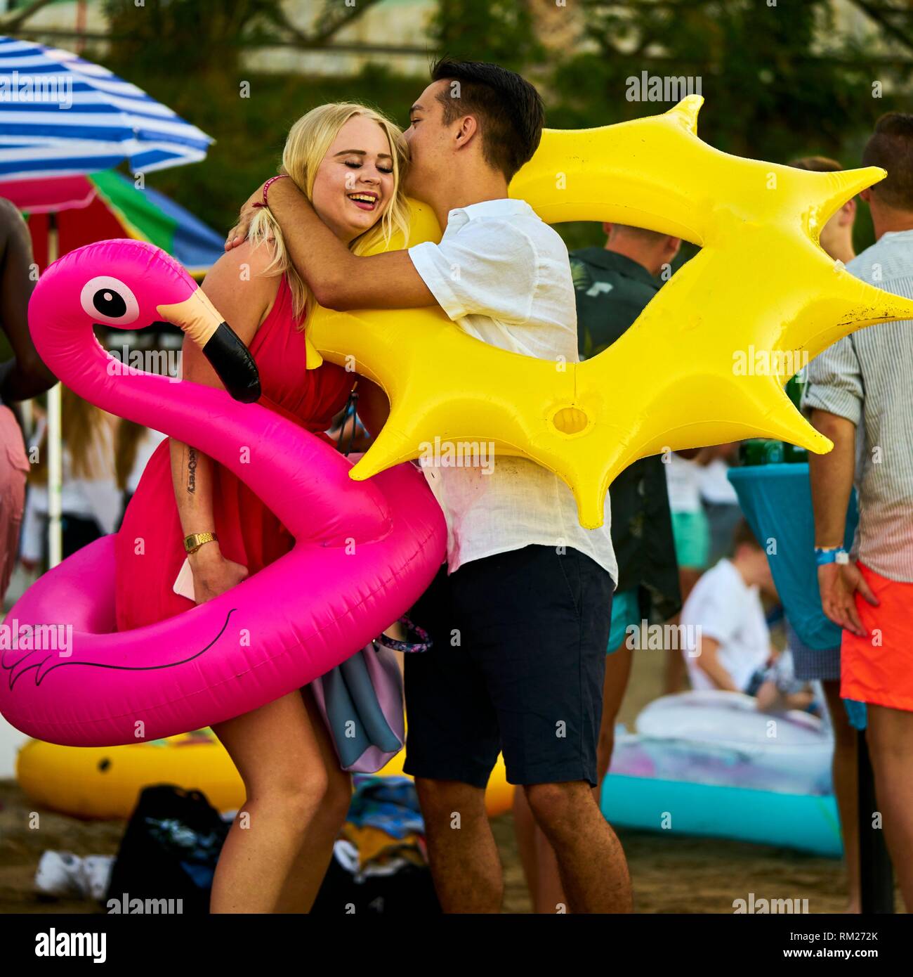 Couple beach float hi-res stock photography and images - Alamy