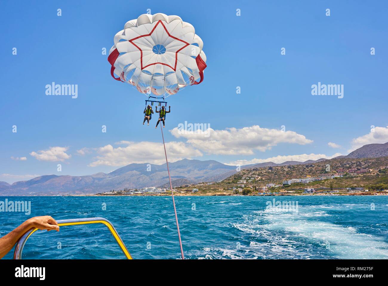 Couple during parasailing. Chersonissos. Crete, Greece Stock Photo - Alamy