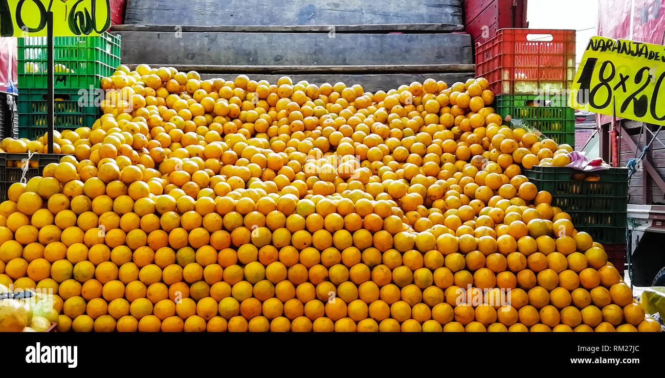 a huge stack of fresh mandarins in a mexican market Stock Photo - Alamy