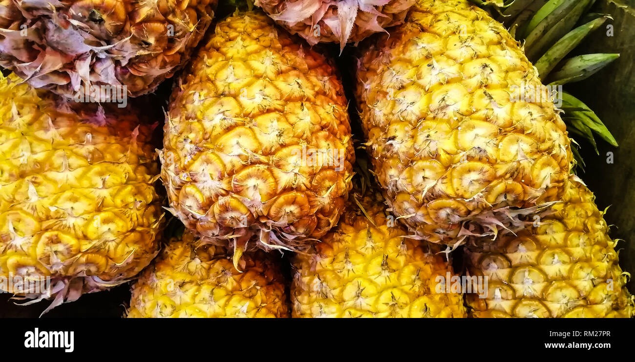 close up to a texture of a stack of pineapples Stock Photo - Alamy