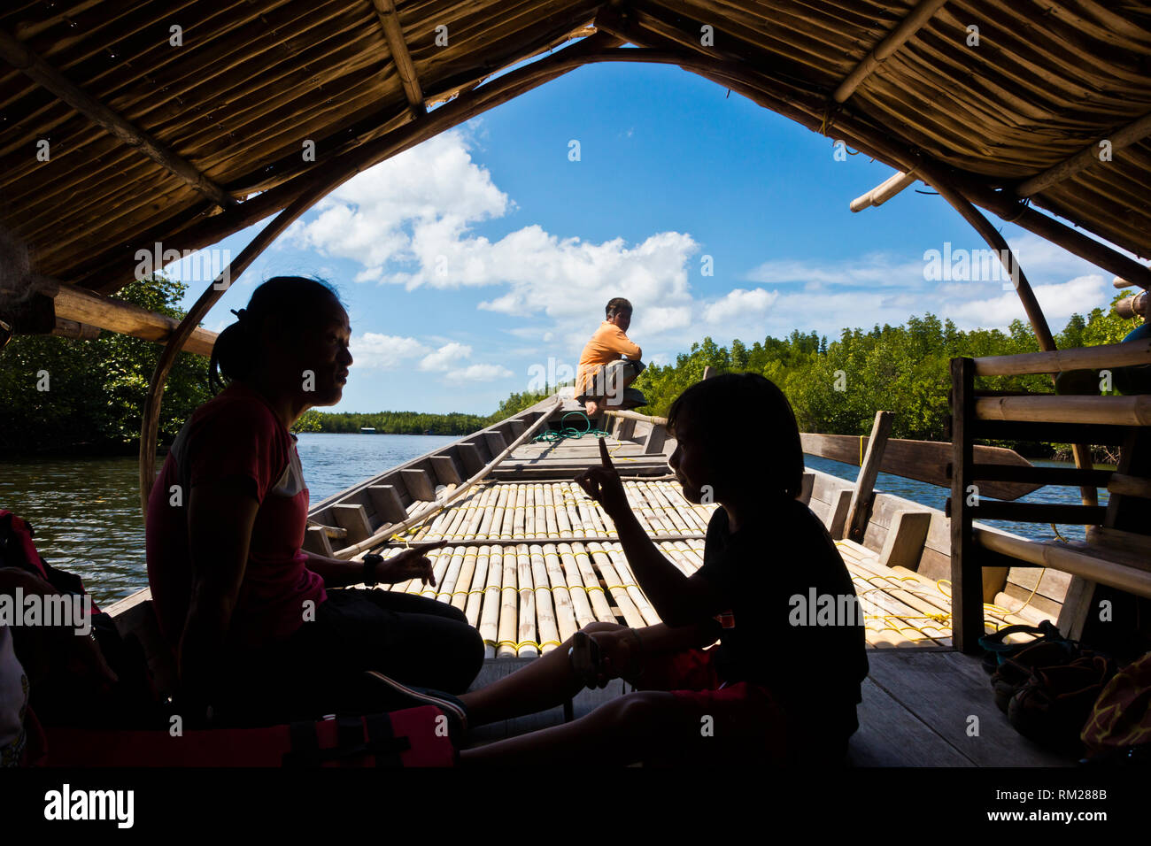 A MOKEN MAN gives a tour on his traditional boat to KHO RA ISLAND in ...
