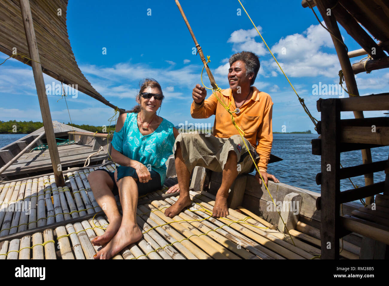A MOKEN MAN gives a tour on his traditional boat to KHO RA ISLAND in ...