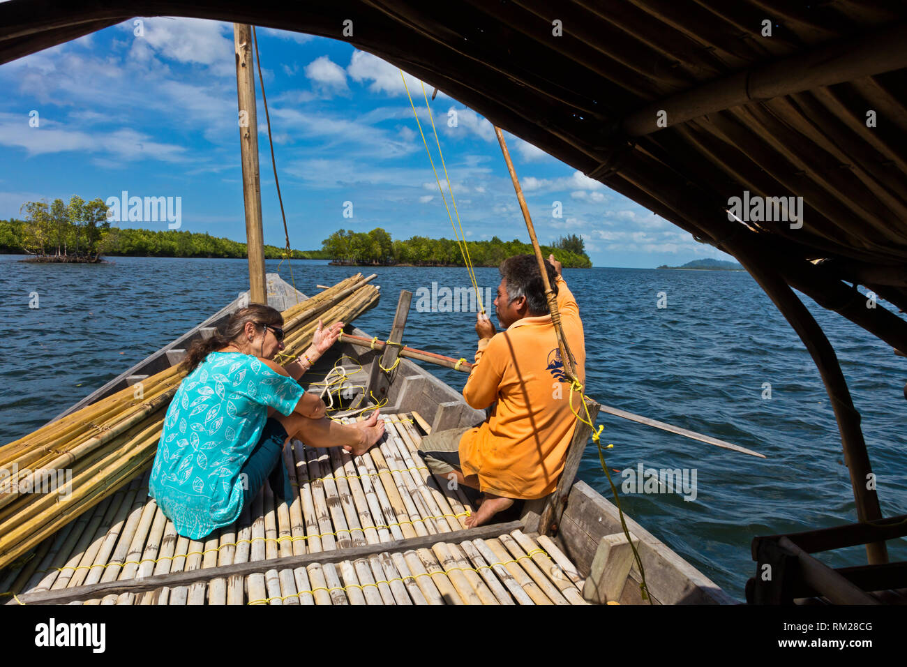 A MOKEN MAN gives a tour on his traditional boat to KHO RA ISLAND in ...