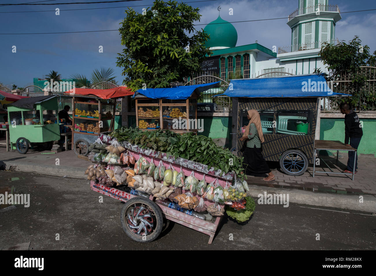 Food sellers, by Masjid An-Nur Mosque, Dili, East Timor Stock Photo - Alamy