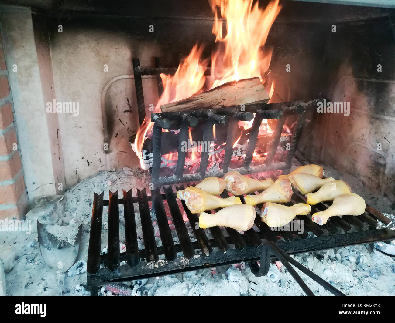 Grilled meat cooked on fireplace Stock Photo - Alamy