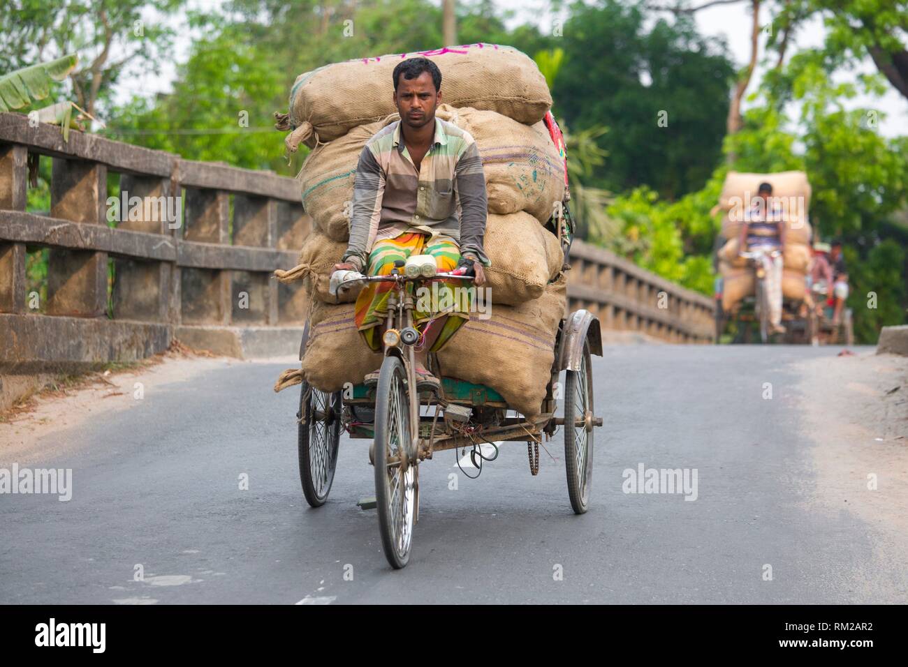 Farmer on bicycle hi-res stock photography and images - Alamy