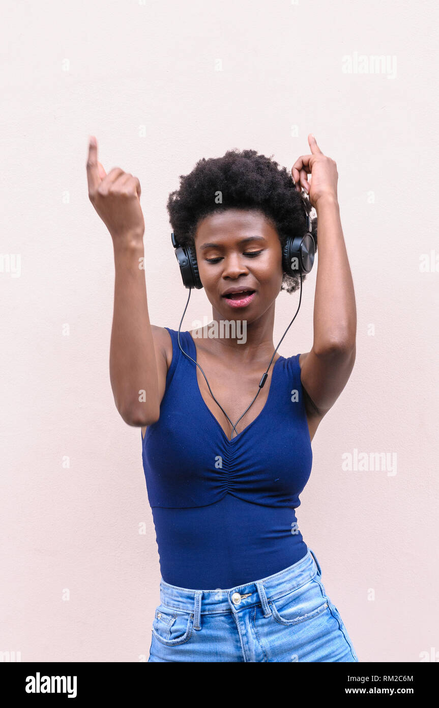 Beautiful Happy Black Afro American Young Woman Listening To Music With