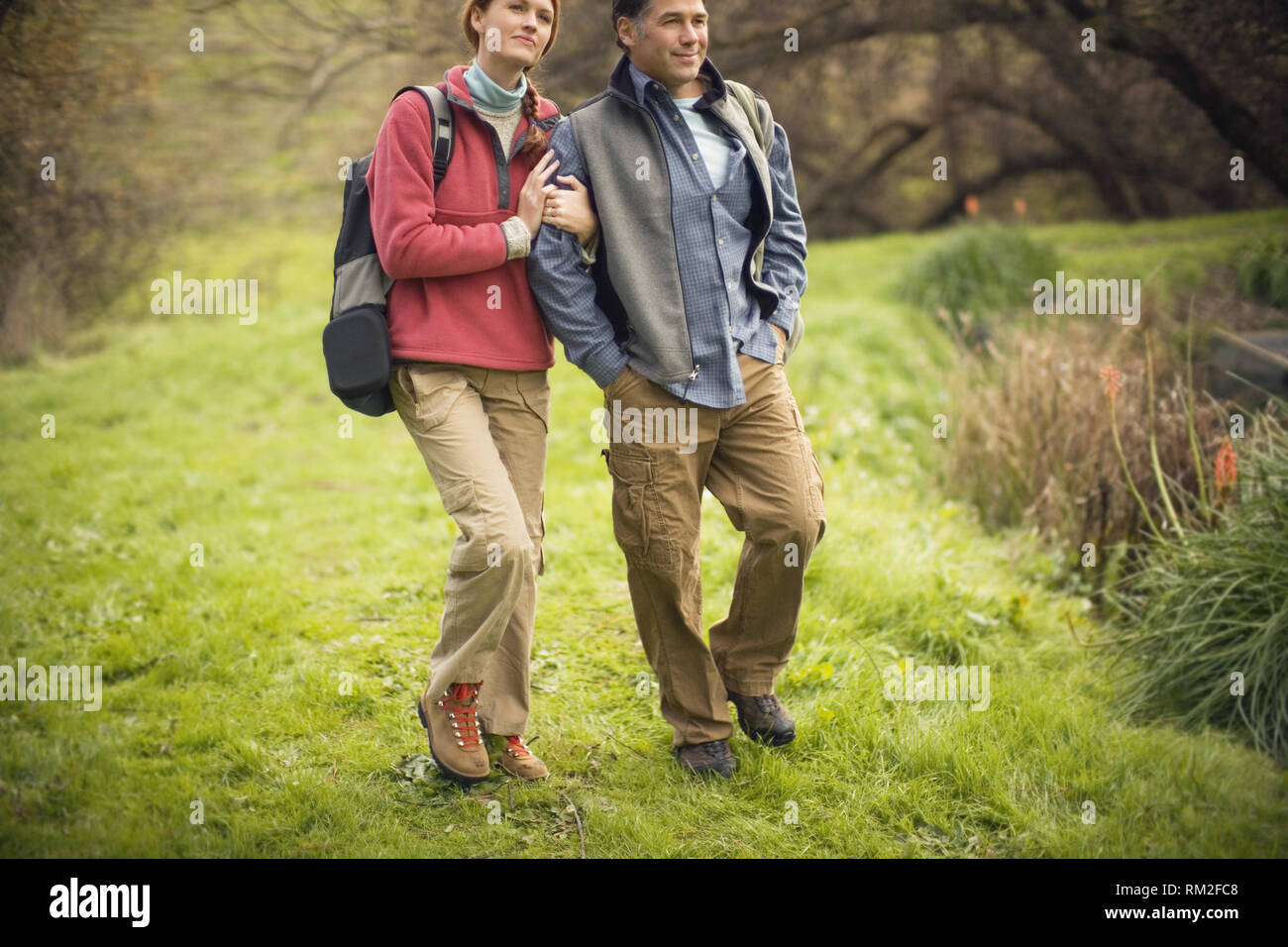 Two women walking arms linked hi-res stock photography and images - Alamy