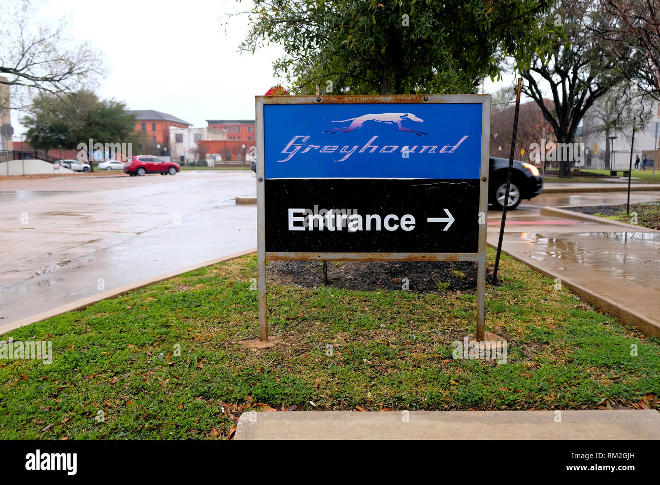 Greyhound Bus line depot entrance sign on a rainy day; Bryan, Texas ...