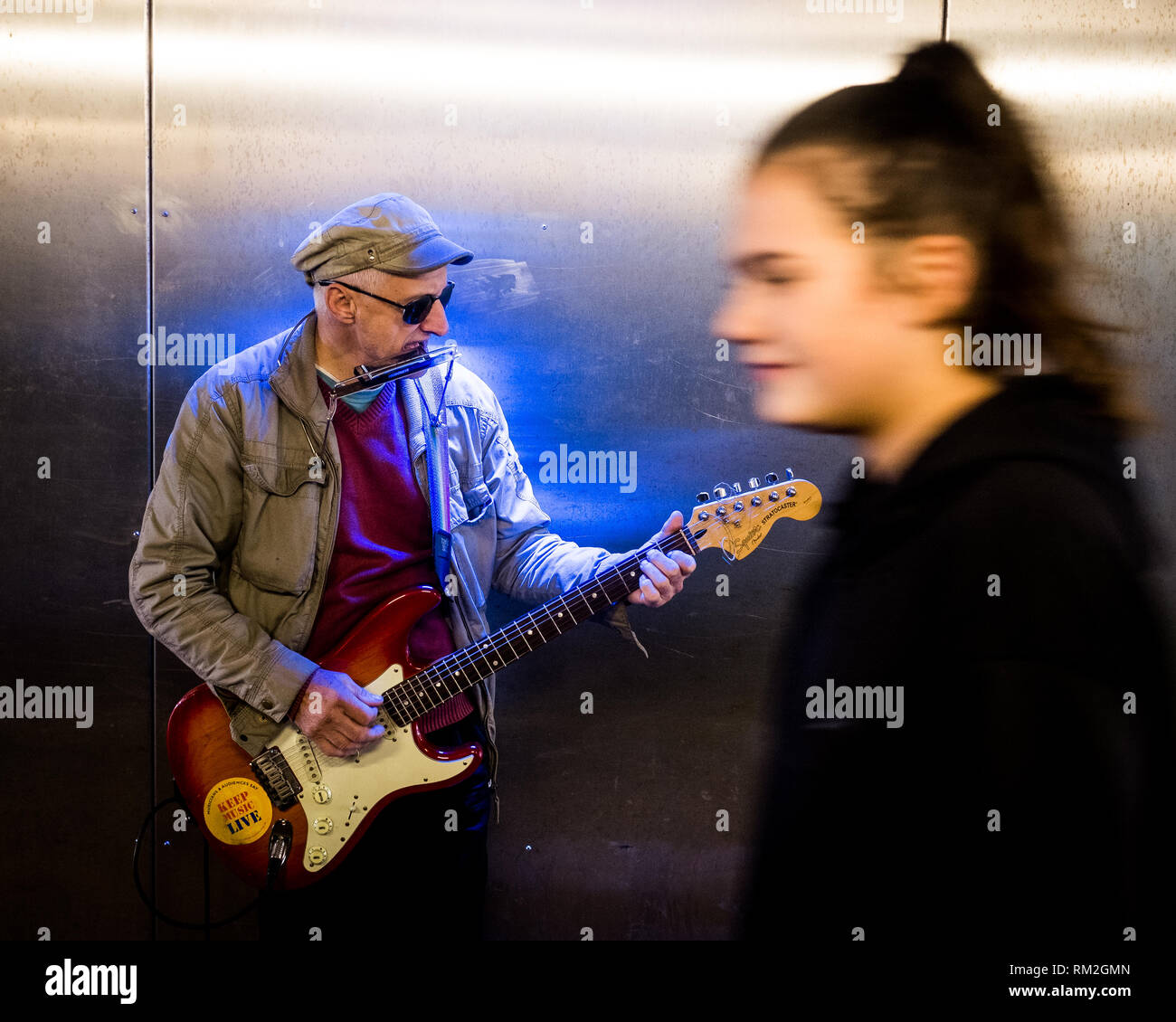 Male busker fort william underpass entertains as strangers pass by ...