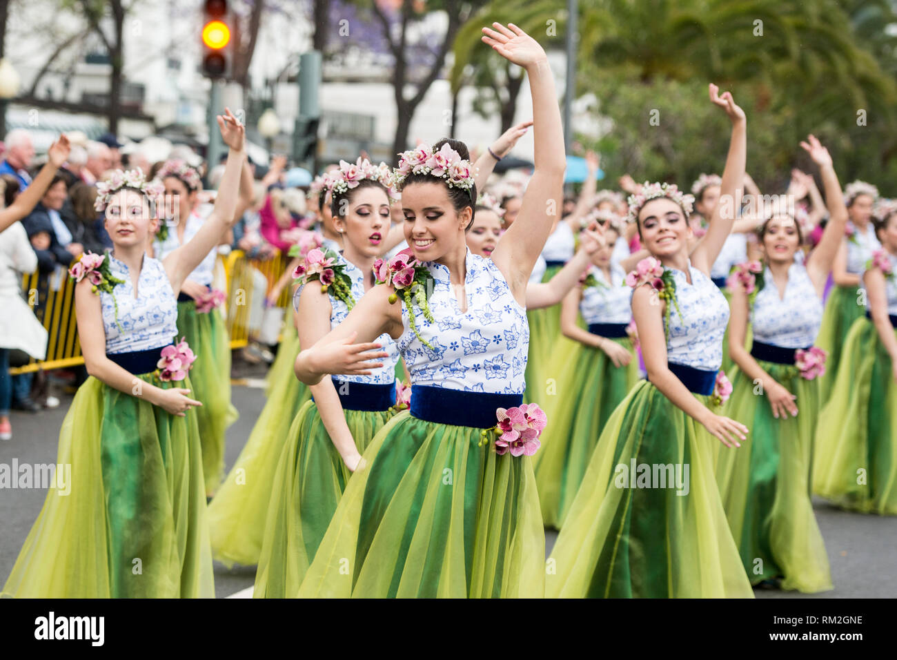 women dressed in colorful clothes at the Festa da Flor or Spring Flower ...