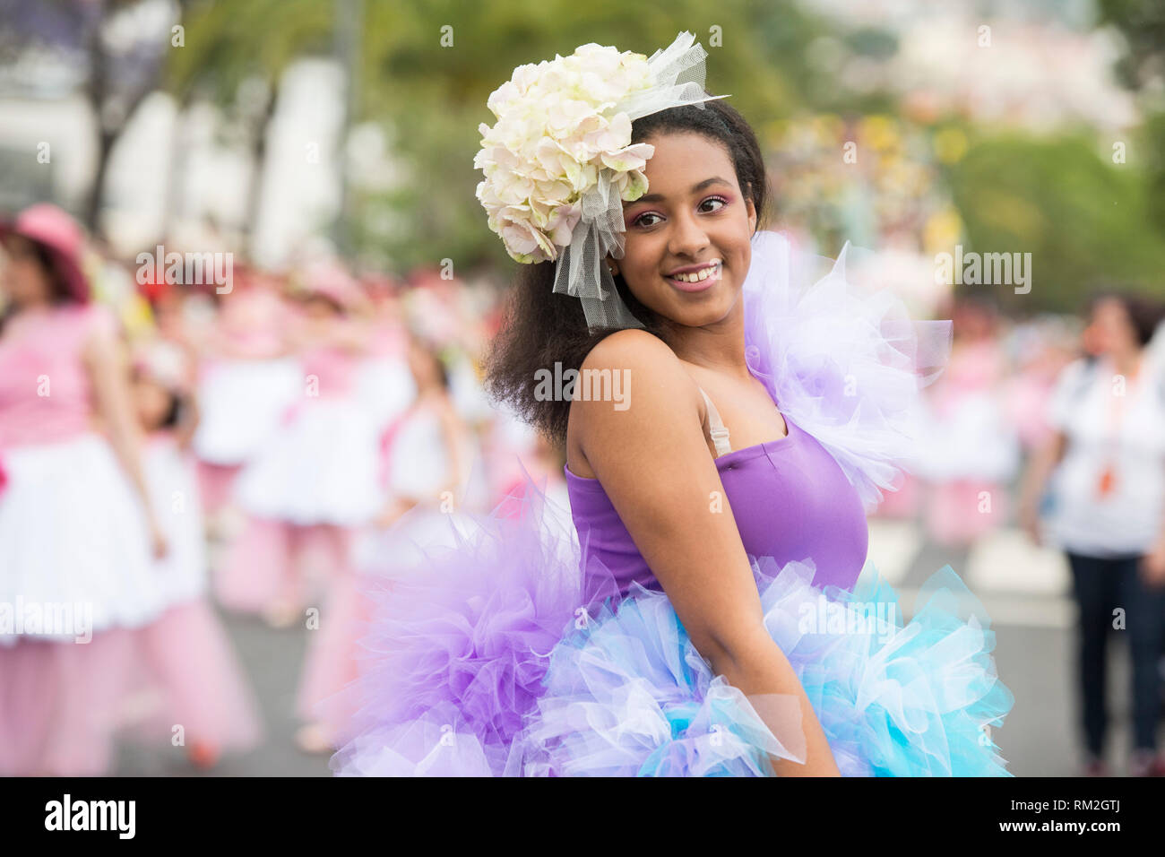 women dressed in colorful clothes at the Festa da Flor or Spring Flower ...