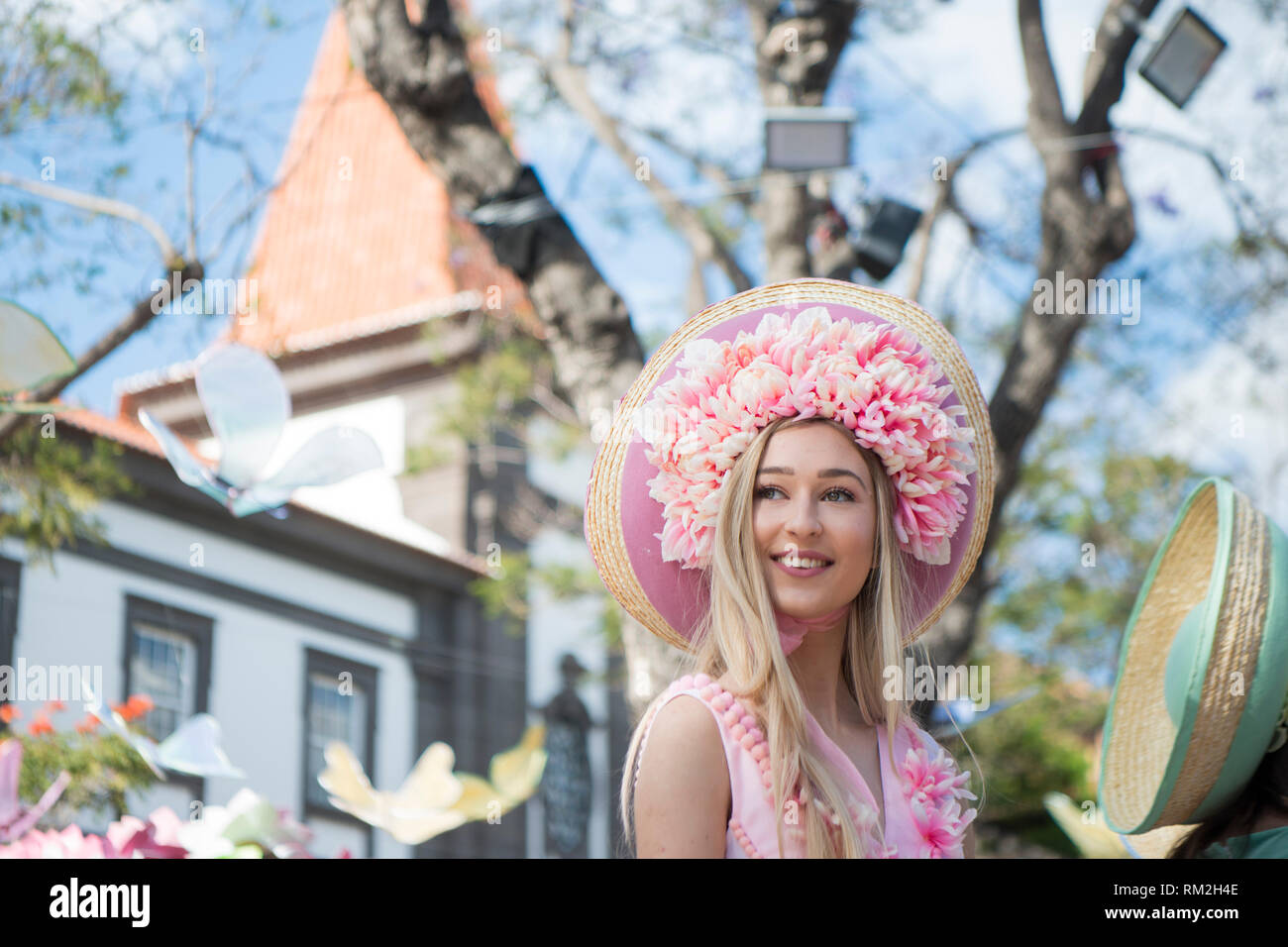 women dressed in colorful clothes at the Festa da Flor or Spring Flower ...