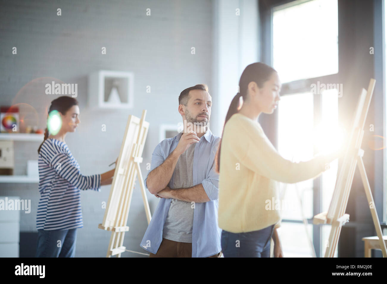 Teacher of painting Stock Photo - Alamy