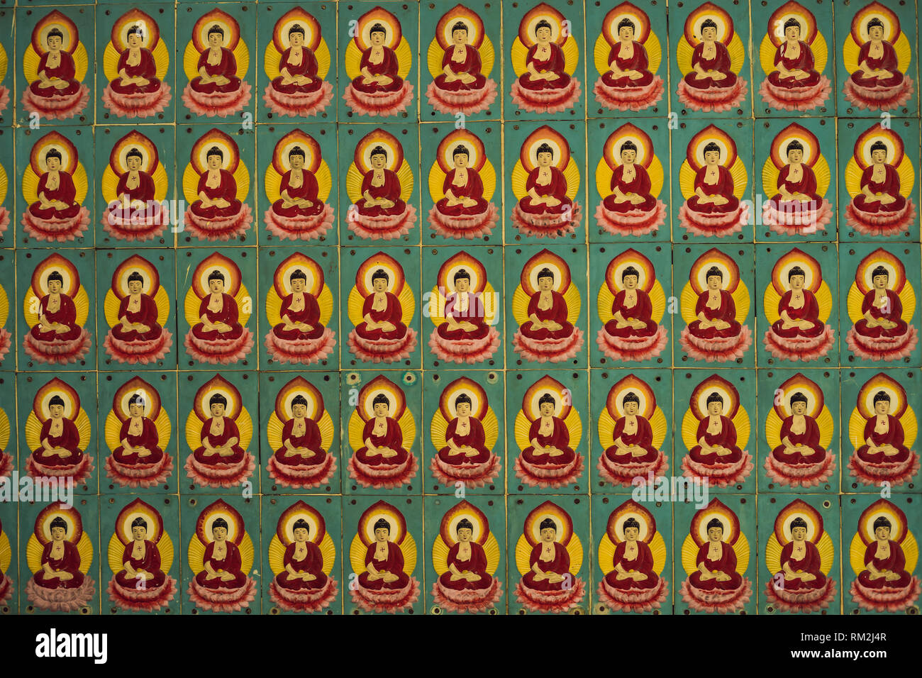 The wall in the temple is filled with buddhas. Religion Buddhism ...