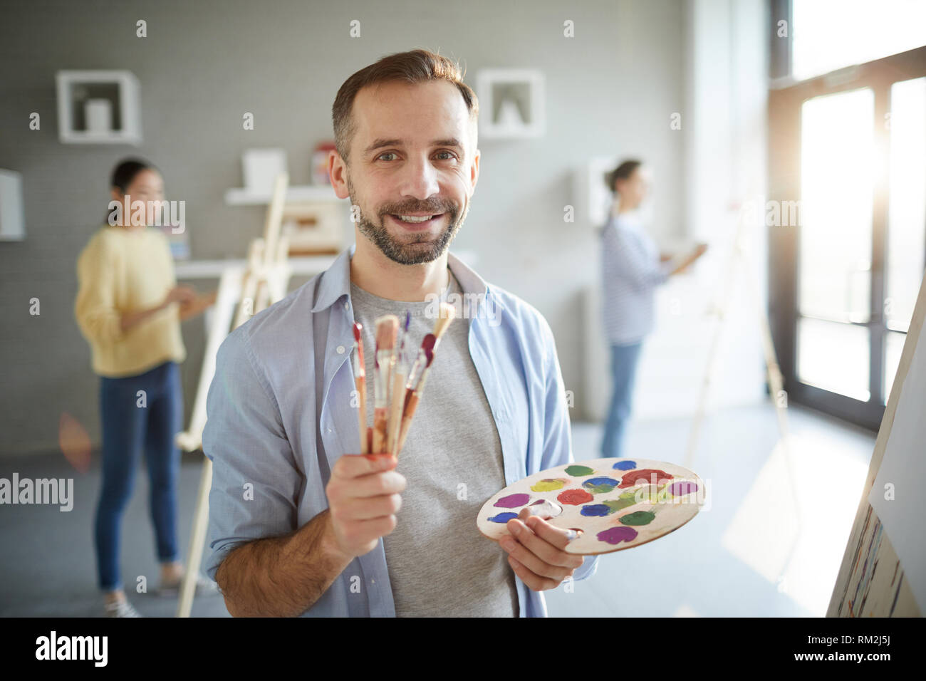 Painter in studio Stock Photo - Alamy