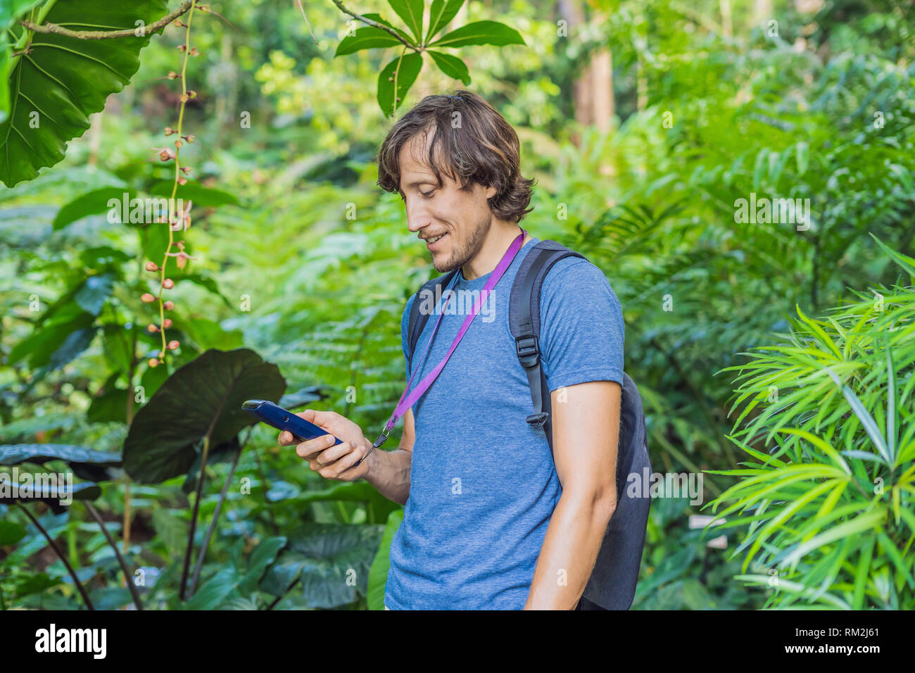 A man listens to a radio guide, tourism concept Stock Photo - Alamy