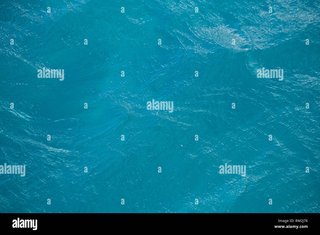 Blue wavy water surface as background Stock Photo - Alamy