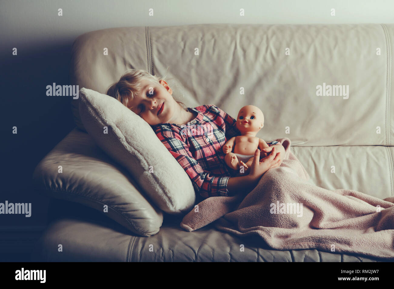 Child sleeping with toy. Cute Caucasian girl holding cuddling with baby ...