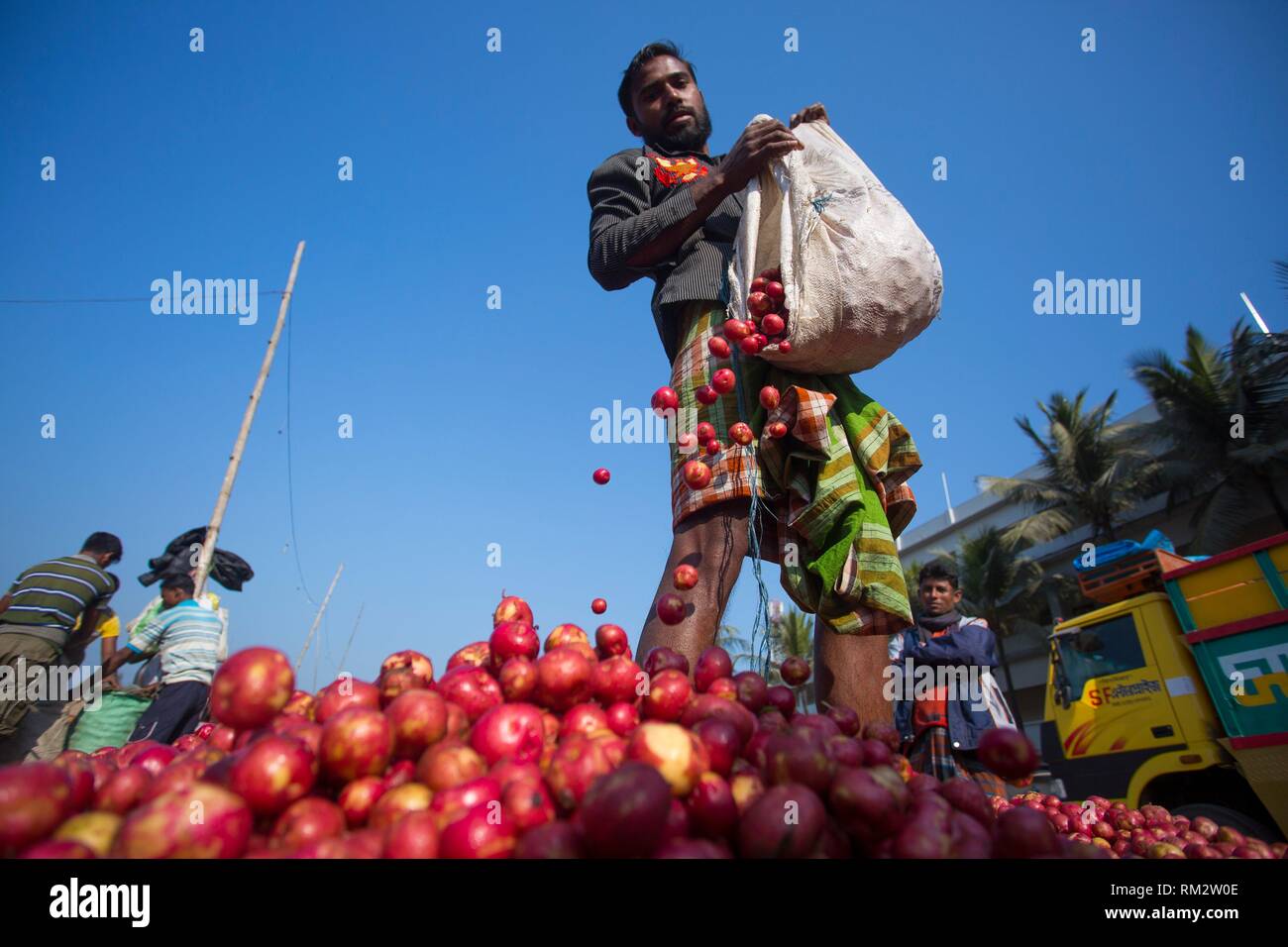 Labors are stacking vegetables in mahasthan hat (popular vendor market ...