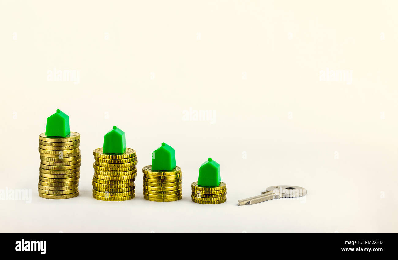 House key and mini houses about the coins , Real estate investment ...