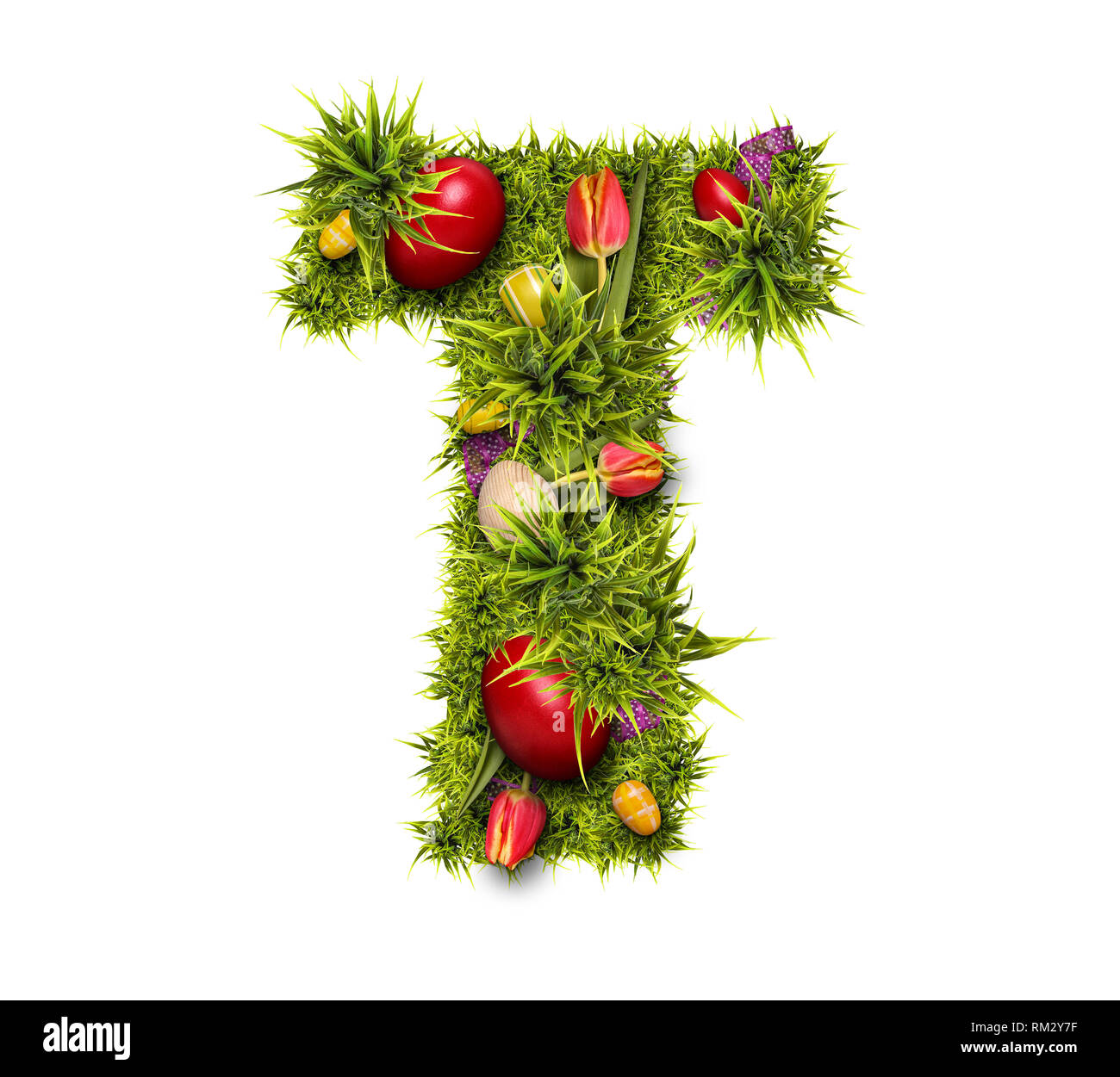 Easter holiday letter T made of fresh green grass and Easter eggs ...