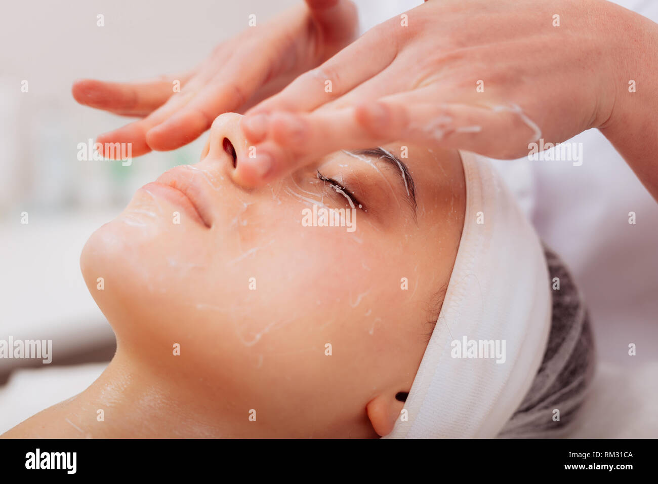 Woman caring face beautician hi-res stock photography and images - Alamy