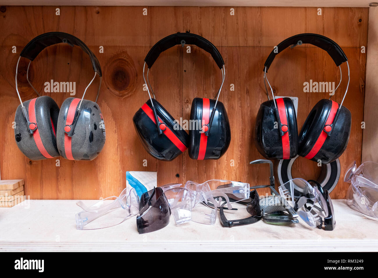 Ear and eye protection on a shelf in a wood shop Stock Photo - Alamy