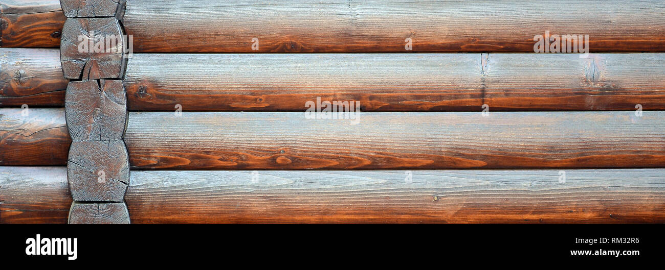 Hewn timber. Rustic log wall horizontal timber background. Fragment of ...
