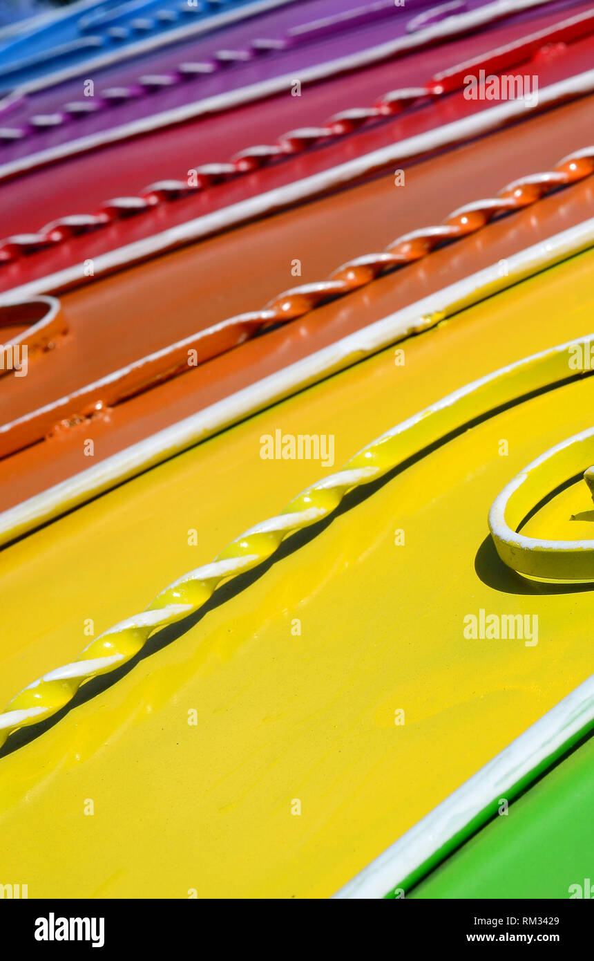 Metal texture of a piece of colored wall with a forged pattern. Rainbow ...