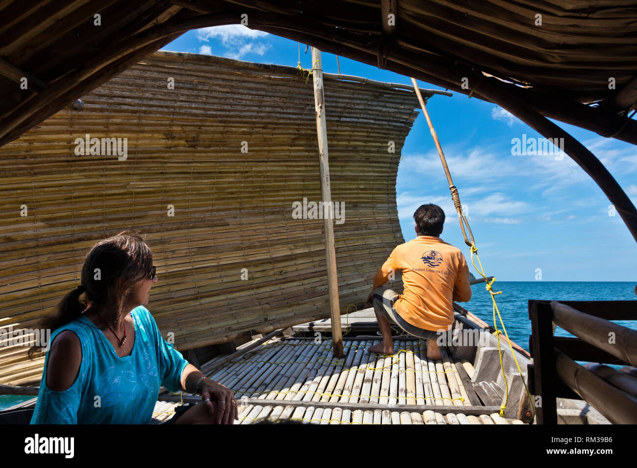 A MOKEN MAN gives a tour on his traditional boat to KHO RA ISLAND in ...