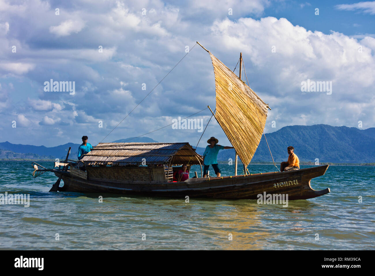A MOKEN MAN gives a tour on his traditional boat to KHO RA ISLAND in ...