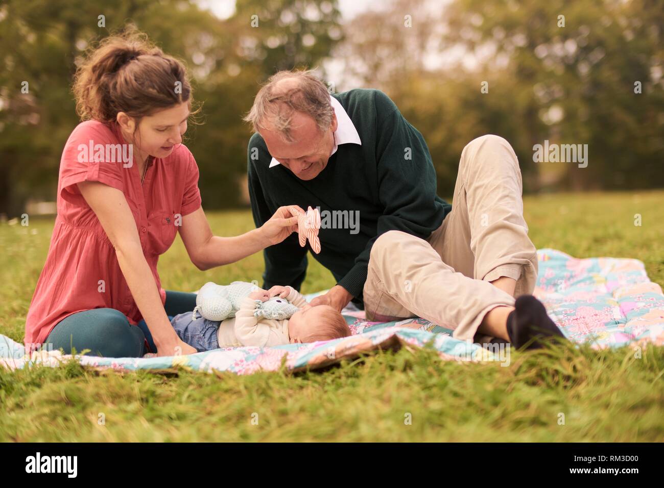 couple, baby, family, age difference, outdoors, in park, generations ...