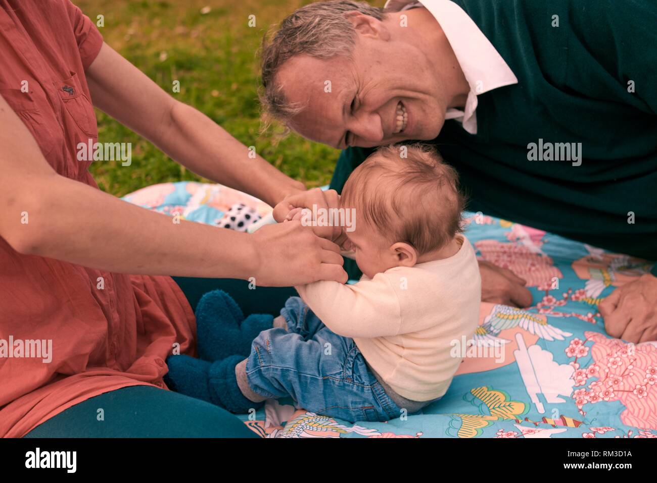 couple, baby, family, age difference, outdoors, in park, generations ...