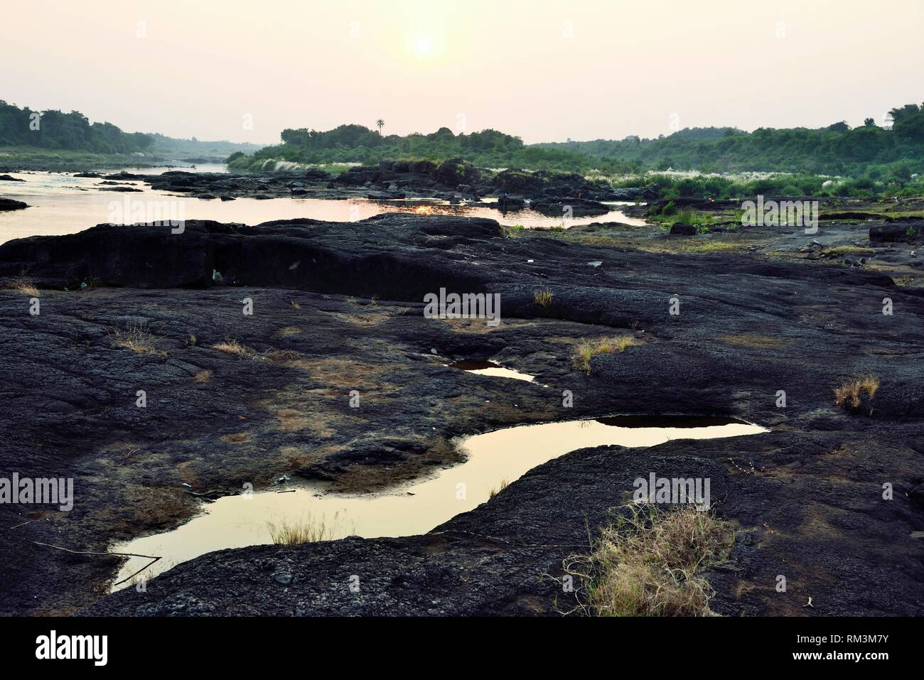Water puddle on rock, Auranga river, Valsad, Gujarat, India, Asia Stock ...