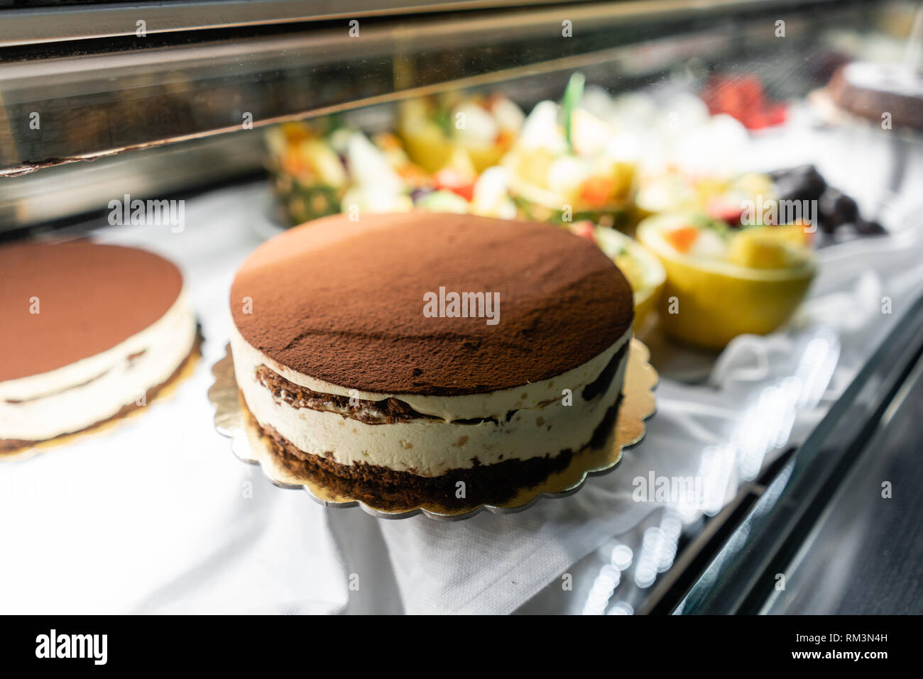 Tiramisu cake. Showcase desserts in an Italian cafe or trattoria ...