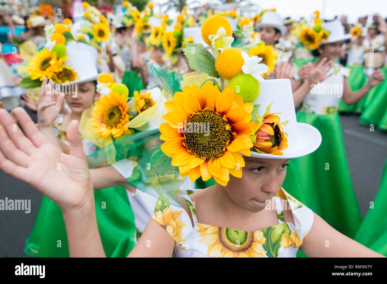children dressed in colorful clothes at the Festa da Flor or Spring ...