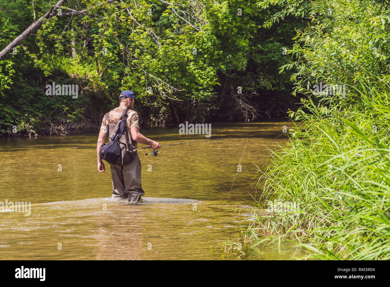 Man using fishing rod hi-res stock photography and images - Alamy