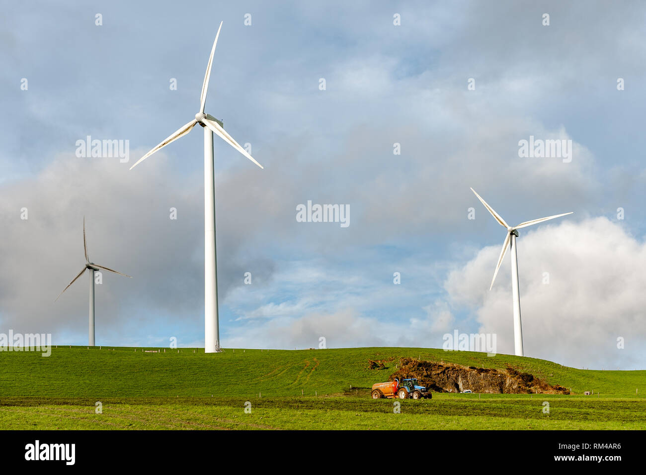Farmer spreads slurry on his farm in Drinagh, West Cork, Ireland under ...