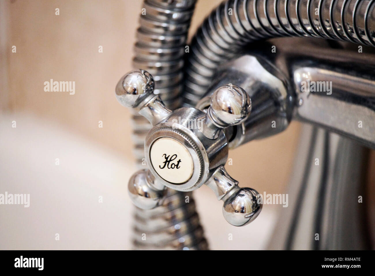 Hot bath tap Stock Photo - Alamy