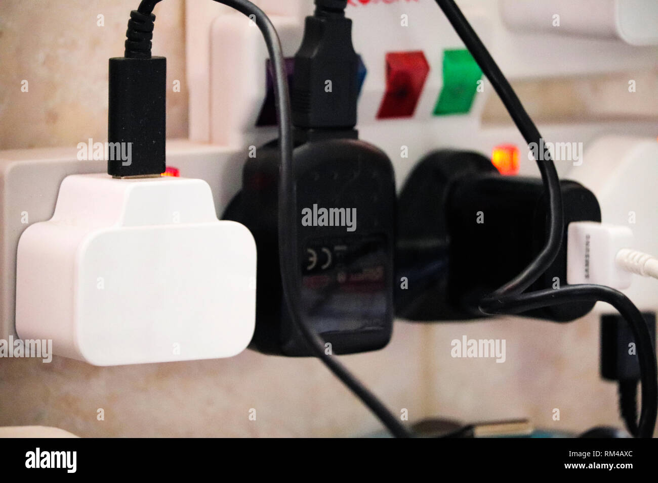 Electric plugs in sockets Stock Photo - Alamy