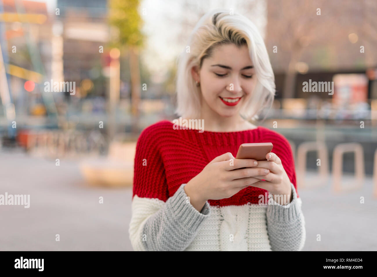 Woman sending a message Stock Photo - Alamy