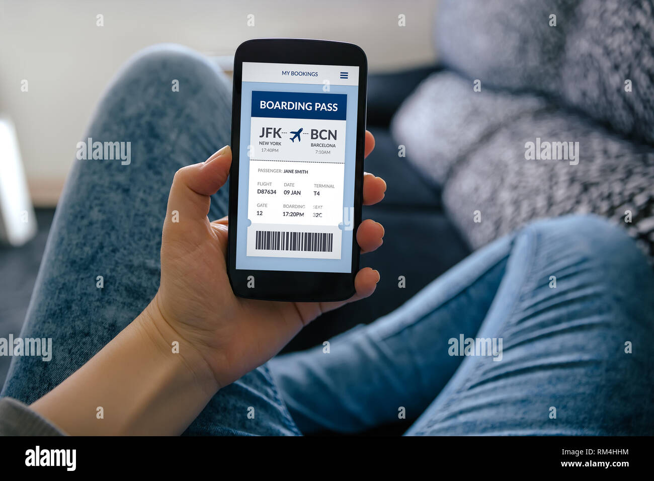 Girl holding smart phone with boarding pass concept on screen. All ...