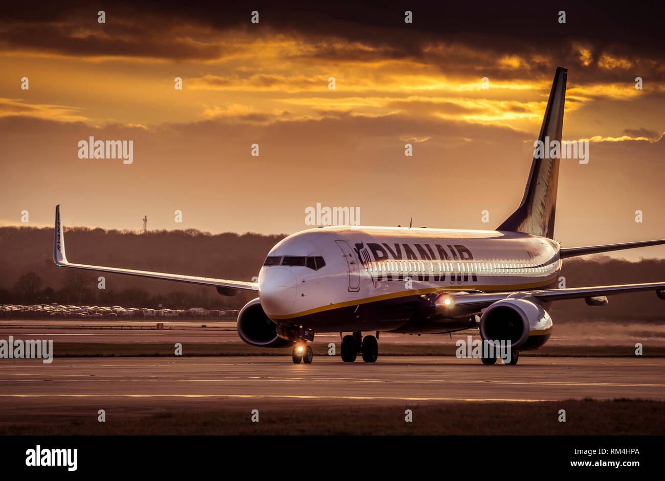 Aeroplane belong to Ryanair waiting on the runway at Gatwick Airport in ...