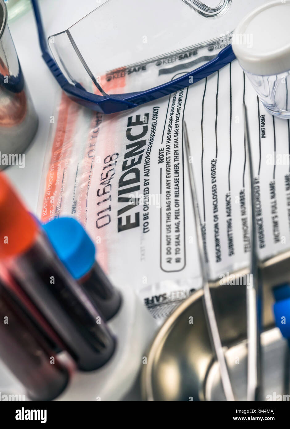 Evidence bag, Police scientific laboratory, conceptual image, vertical ...