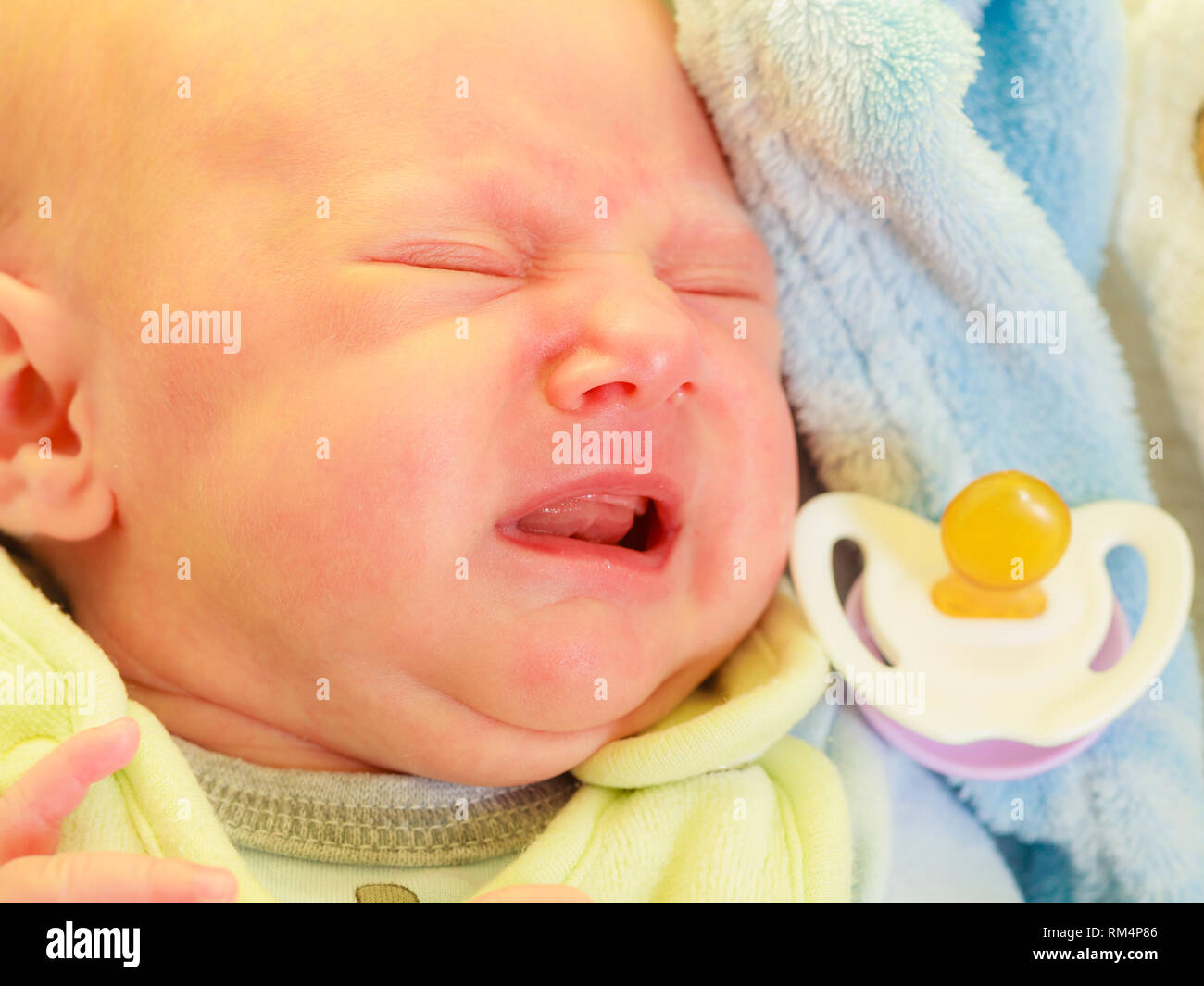 Infant care, teething pain, colic ache concept. Little newborn baby ...