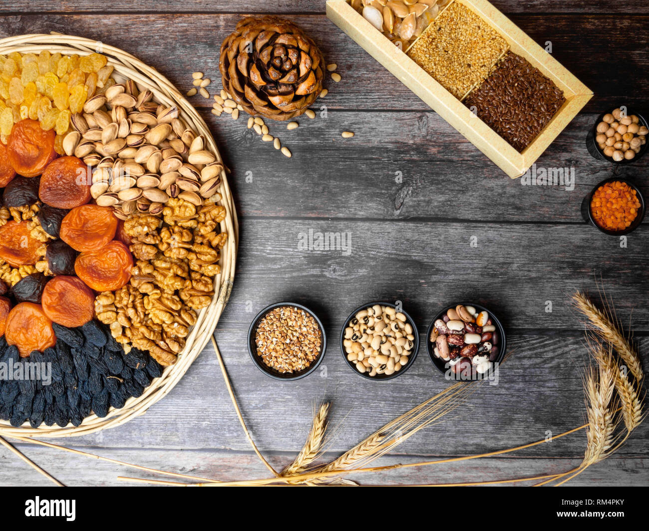 Health food background border with dried apricot, grains, pulses, seeds ...