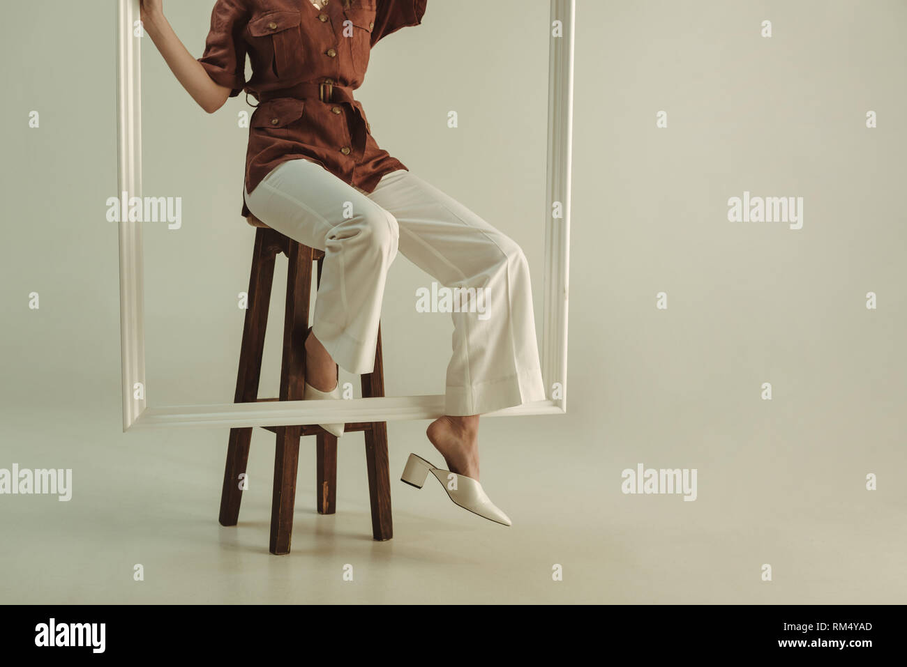 Woman posing on stool hi-res stock photography and images - Alamy
